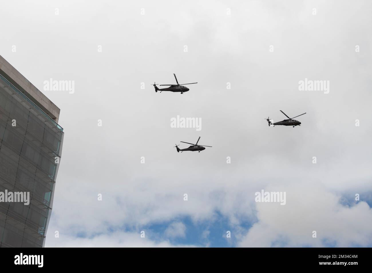 three police helicopters flying over crowd during independence day ...