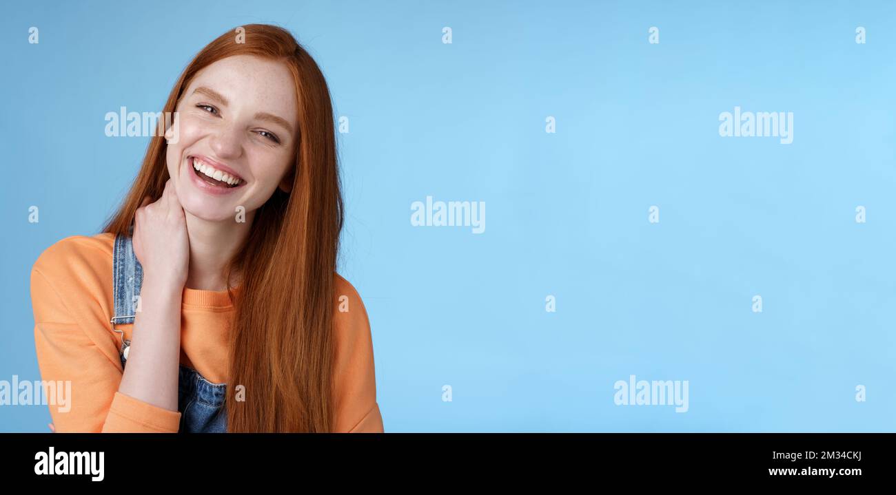 Carefree silly flirty young redhead girlfriend having fun enjoying ...