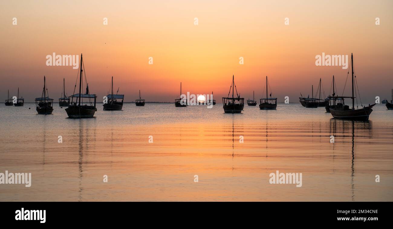 Arab traditional dhows in the shore during the sunrise in Qatar Stock ...
