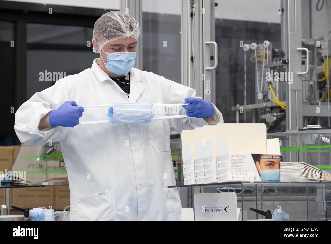 Illustration picture shows worker with masks taken in marge of a visit ...
