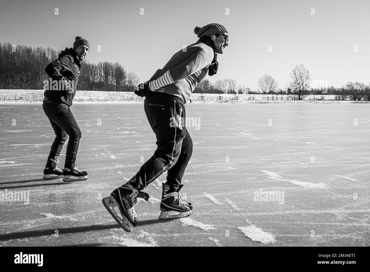 Illustration shows people skating at natural ice at a frozen flood ...