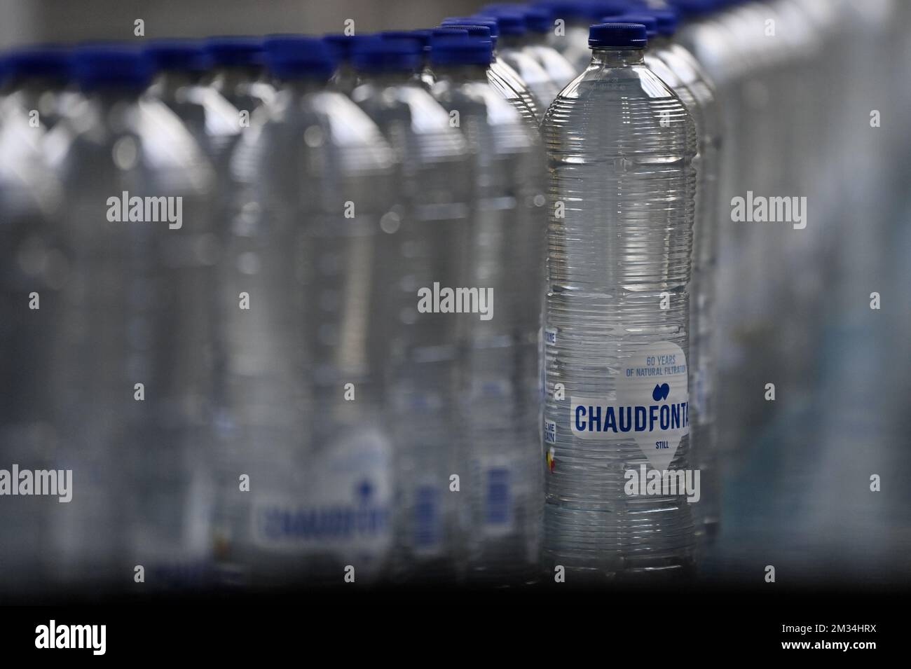 Illustration shows the production chain with bottles of water at the ...