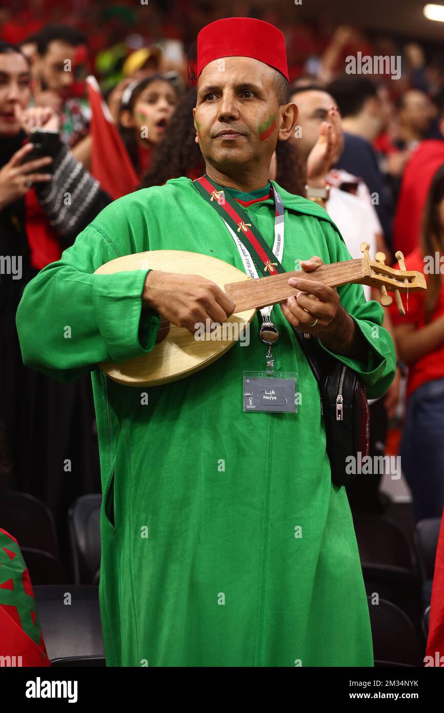 Al Khor, Qatar. 14th Dec, 2022. A Morocco fan supports his team during ...