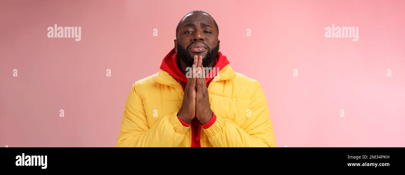 Miserable cute african-american bearded man in yellow coat asking help ...