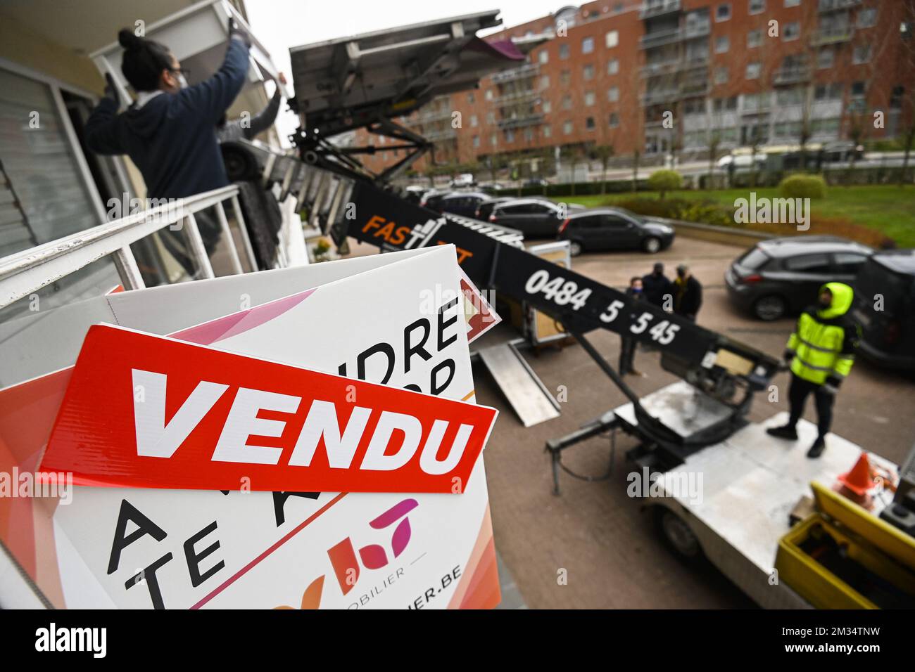 Illustration picture shows a sign that reads 'Vendu' on a 'For Sale ...