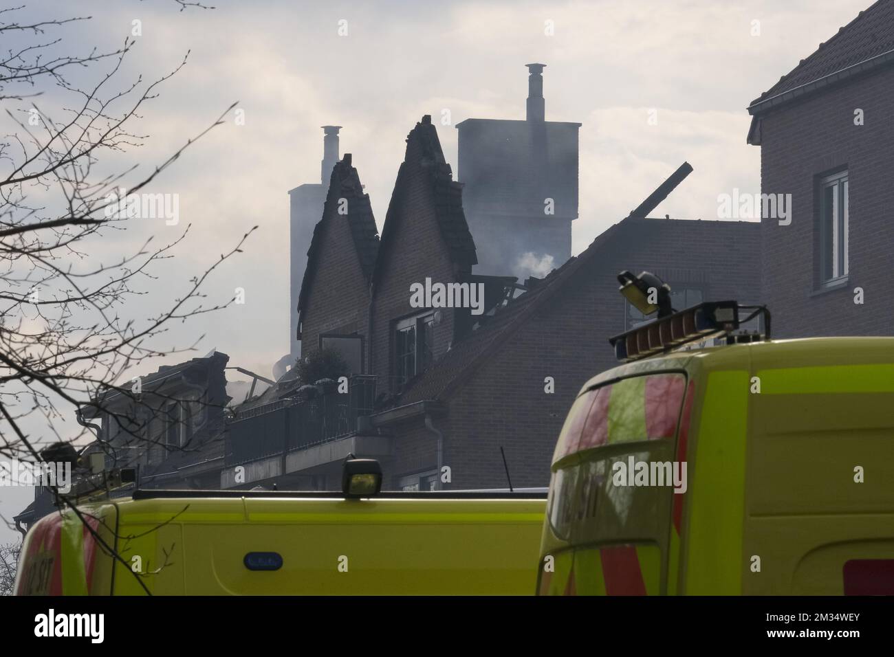 Firefighters pictured in action at a fire in an apartment building ...