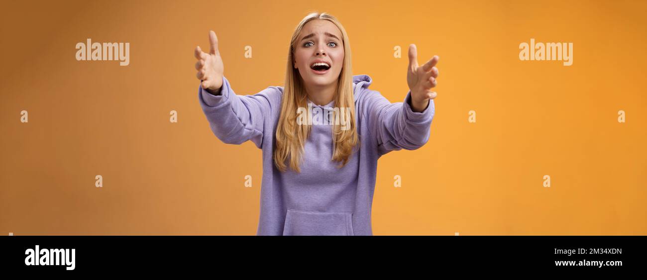 Excited fascinated glad blond woman adore singer performing stage ...