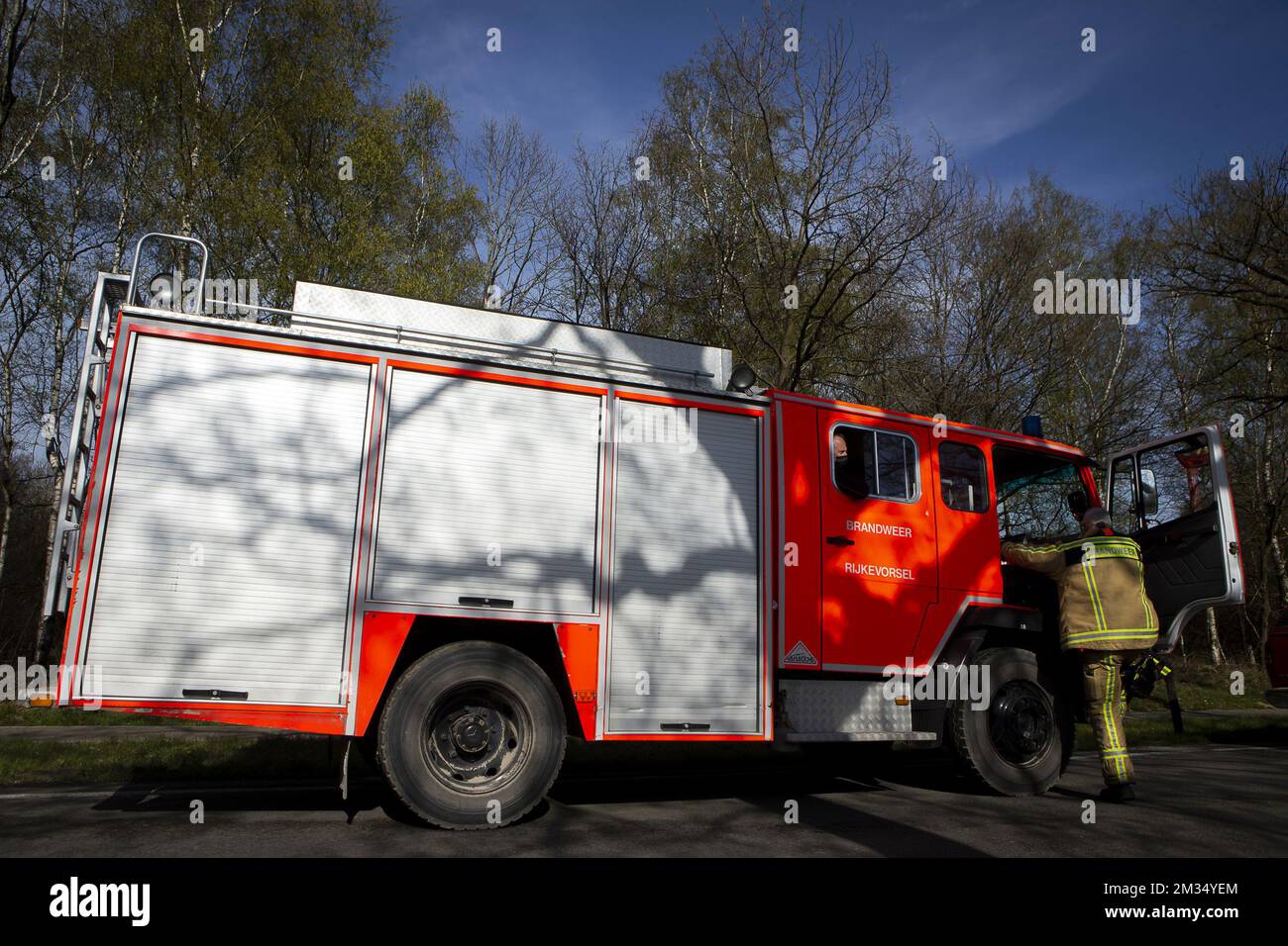 Fire fighters pictured during the aftermath of a fire at military ...