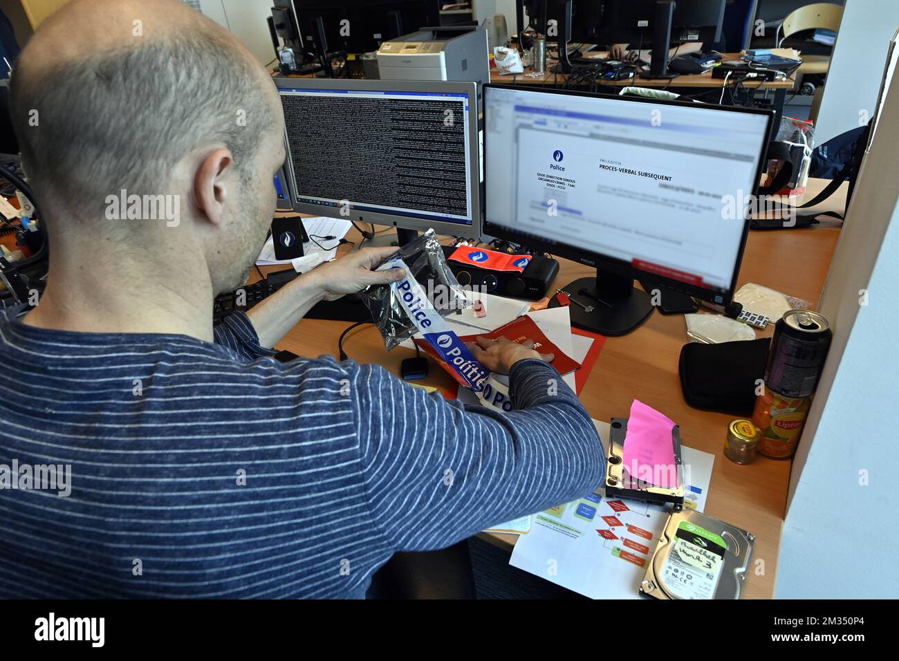 An officer pictured at this desk in the offices of the Federal Computer ...
