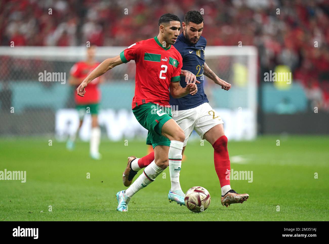 Morocco's Achraf Hakimi (left) and France's Theo Hernandez battle for ...
