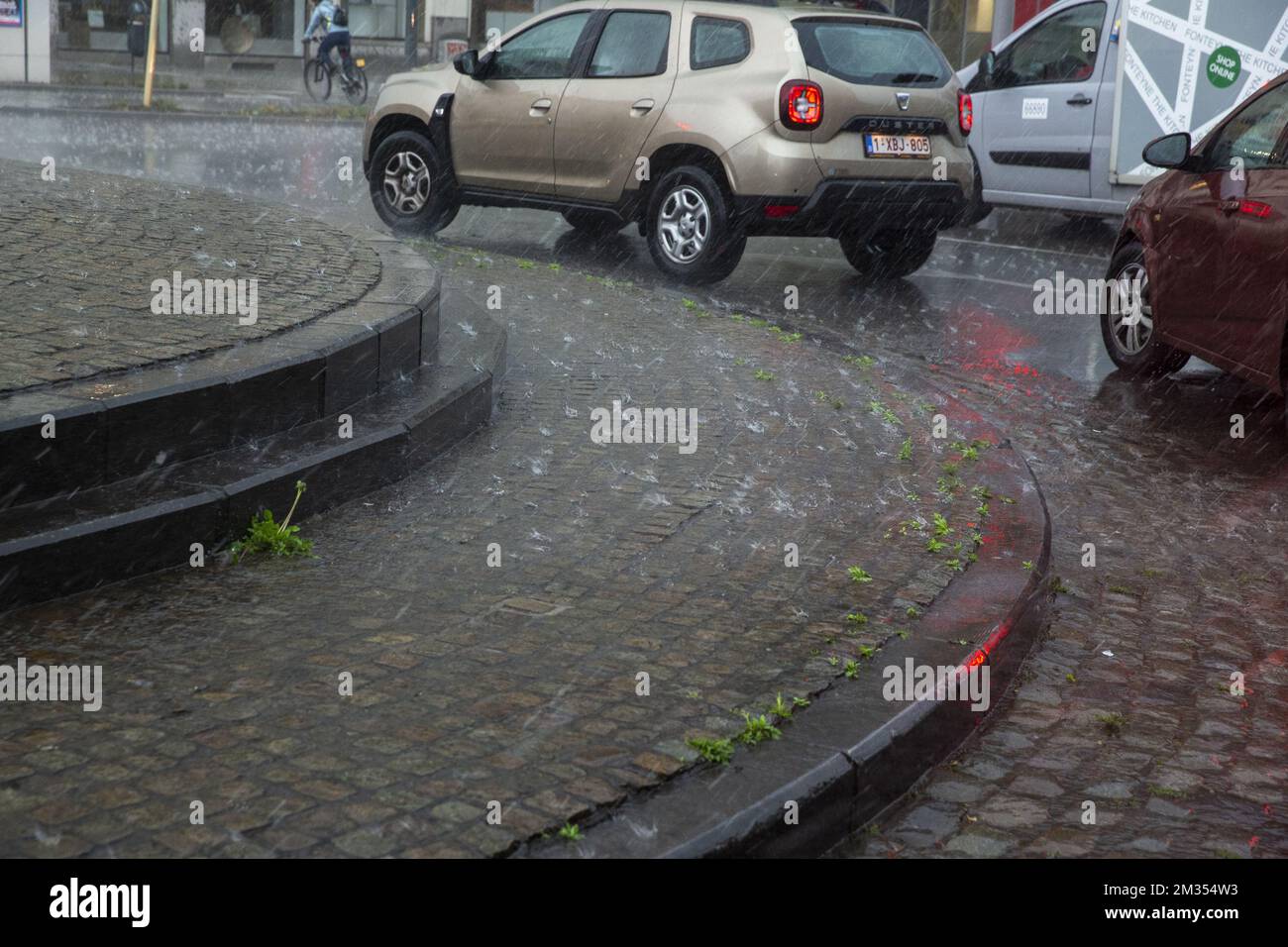 Illustration picture shows heavy rainfall in the streets of Brussels ...