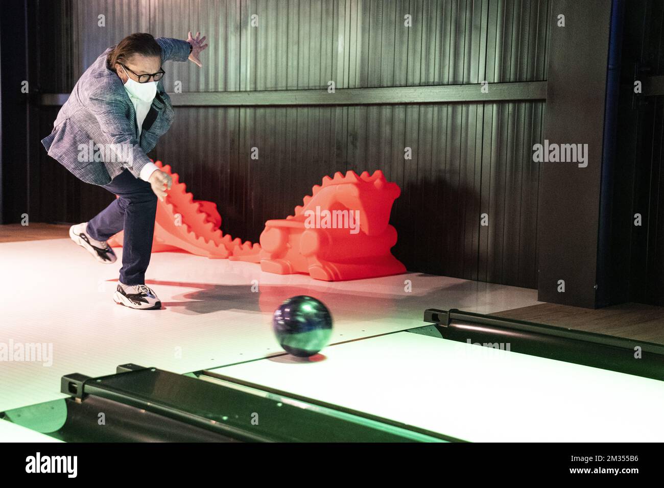Belgian businessman Marc Coucke plays a game of bowling at the opening ...