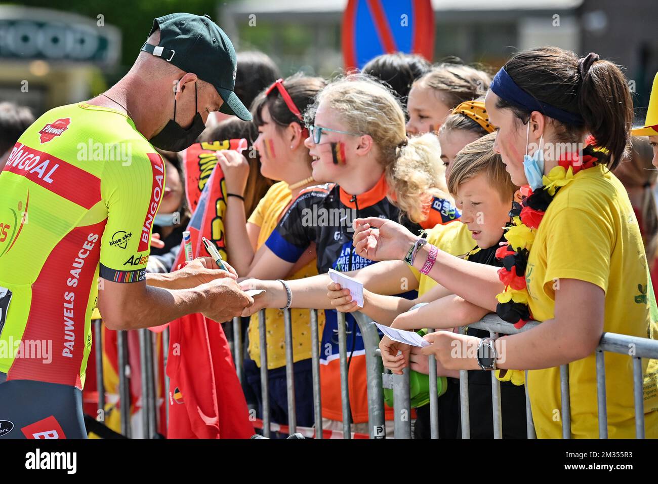 Belgian Timothy Dupont of Bingoal-WB gives a signature ahead of the ...