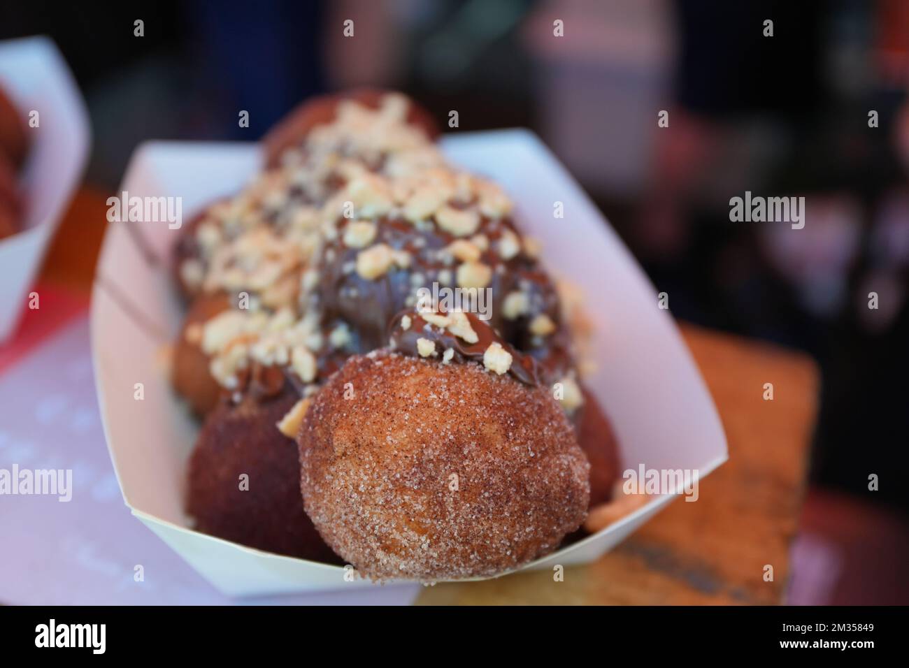 A close-up shot of fried sugar balls in a street market Stock Photo - Alamy