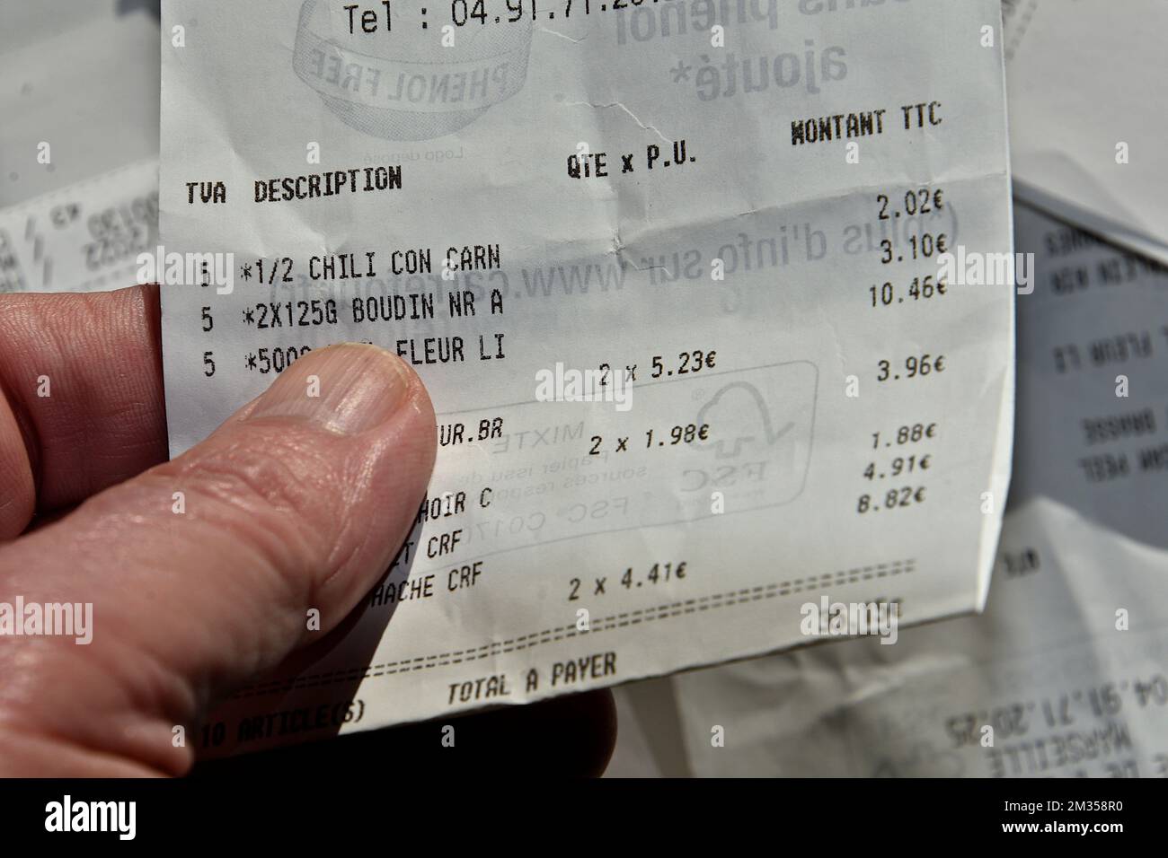 Marseille, France. 11th Dec, 2022. A man holds a purchase receipt ...