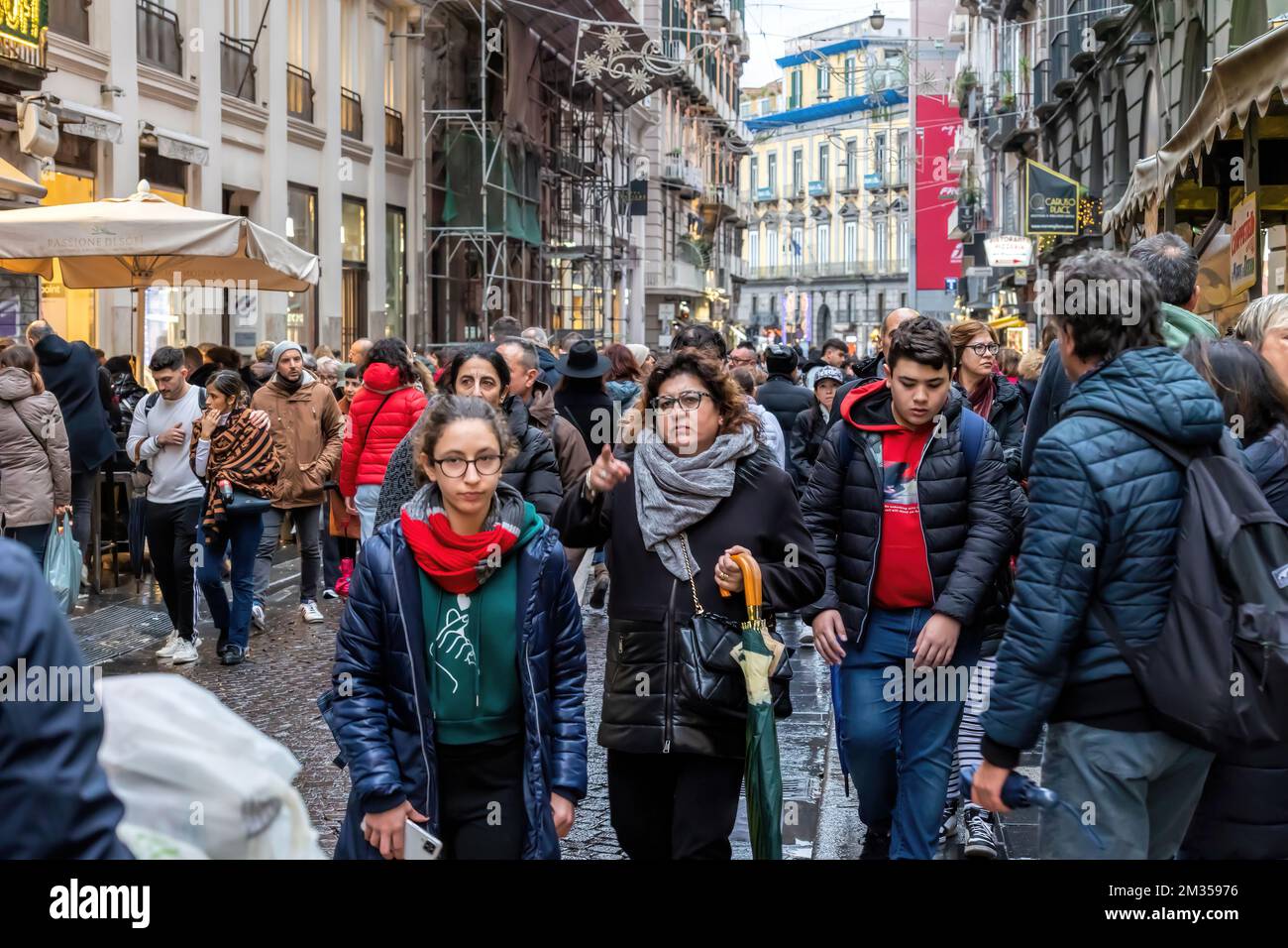 Naples, Italy - December 10, 2022: On a rainy day people stroll in via ...