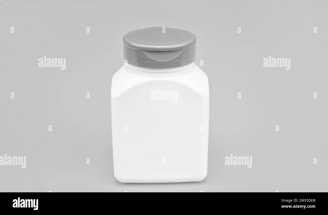 multivitamin bottle on yellow background. food supplement Stock Photo ...