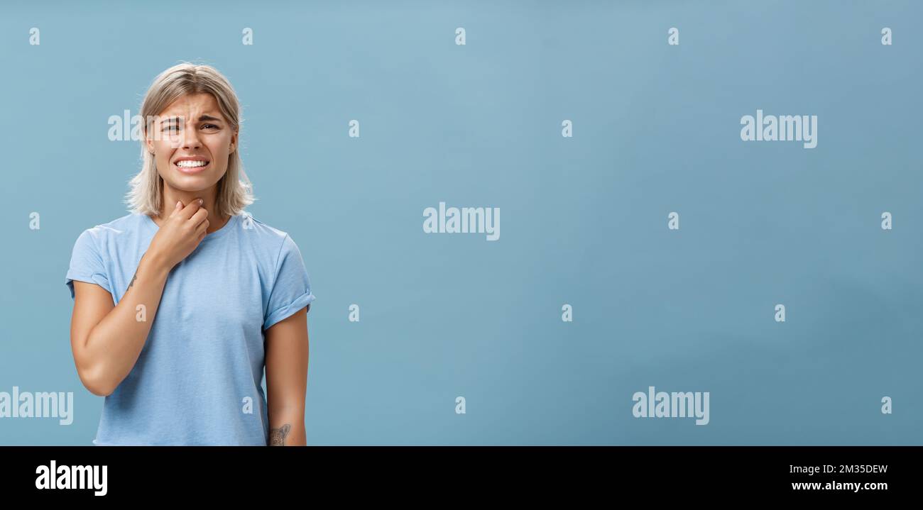 Girl feeling discomfort in throat catching cold or having seasonal ...