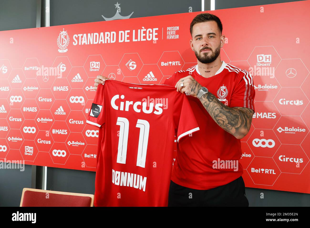 Standard's new player Aron Donnum poses for the photographer after a ...