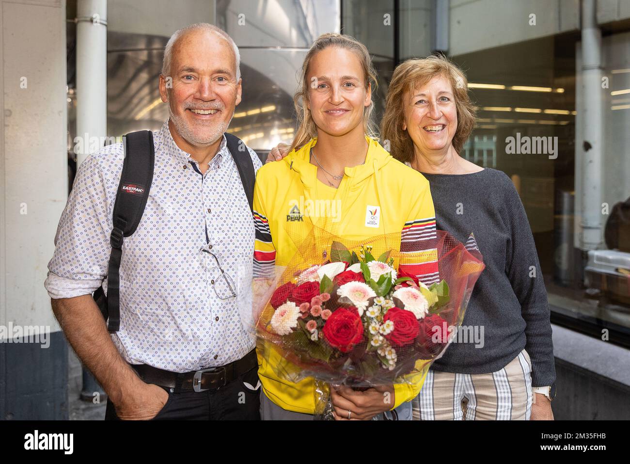 Belgian sailor Emma Plasschaert poses with her parents at the arrival ...