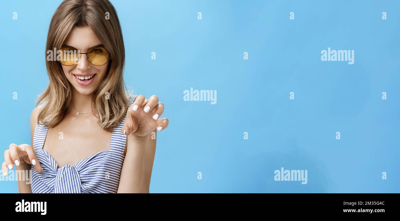 Sensual woman feeling like attractive wild cat raising hands like paws ...