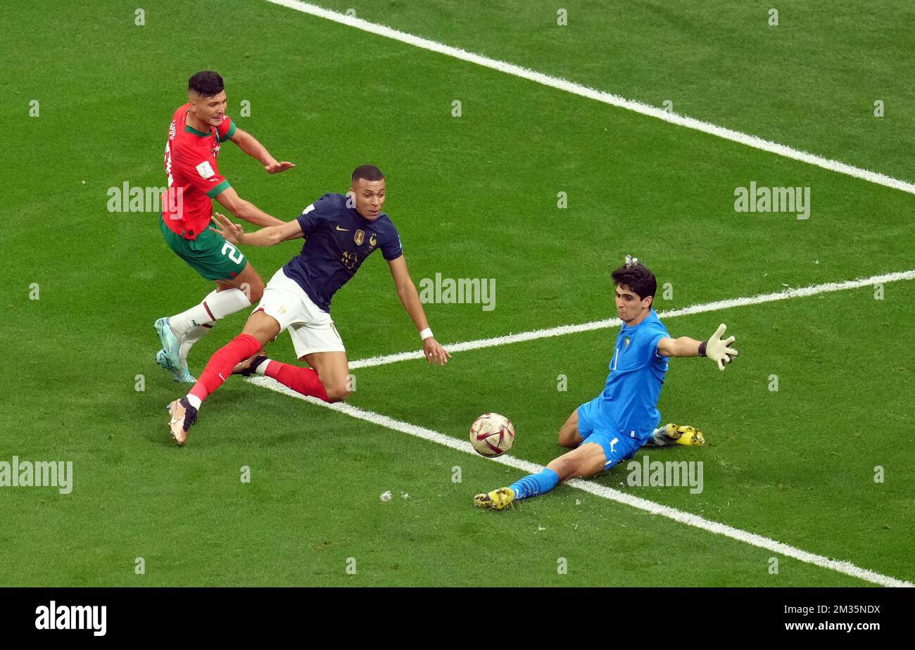 France's Kylian Mbappe sees his shot saved by Morocco goalkeeper ...