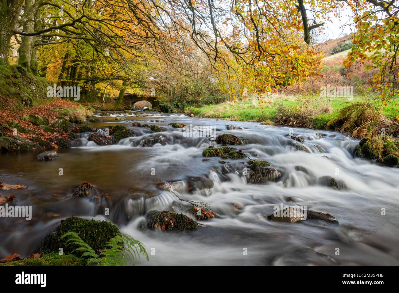 The Weir Water river flowing under Robbers Bridge in Exmoor National ...