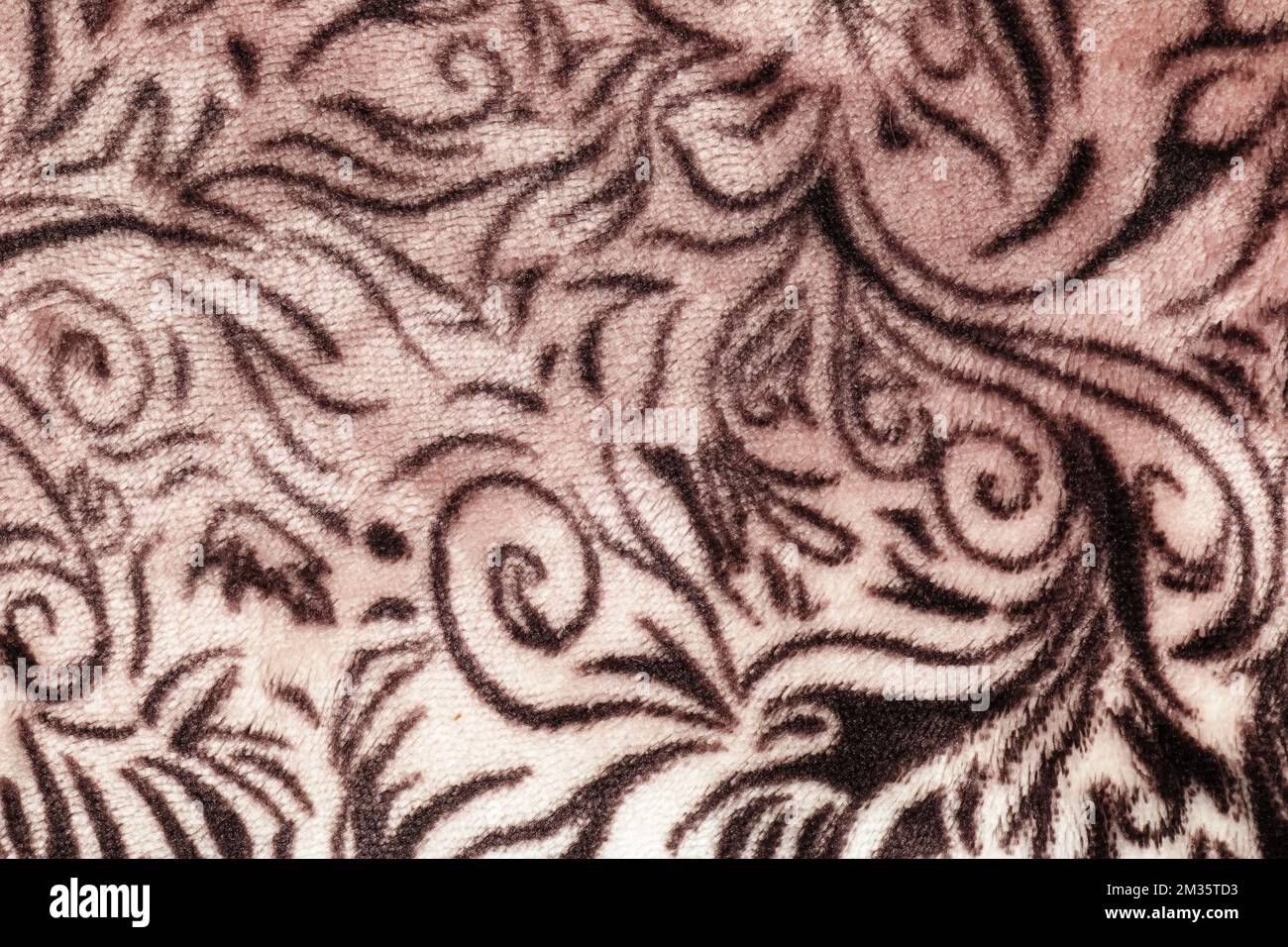Close-up pattern of fleece fabric with leopard pattern. Brown-beige and ...