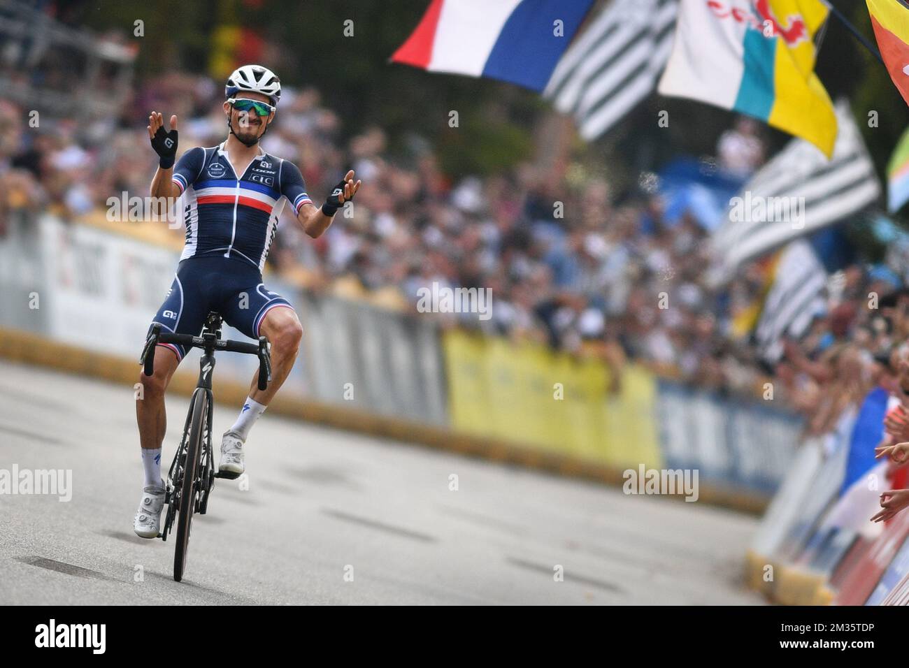 French Julian Alaphilippe celebrates as he crosses the finish line to ...