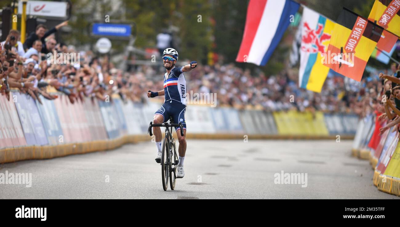 French Julian Alaphilippe celebrates as he crosses the finish line to ...