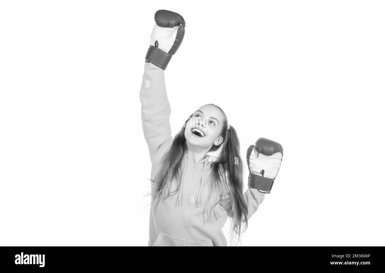 she is champion. winner of fight. teen girl in boxing gloves ...