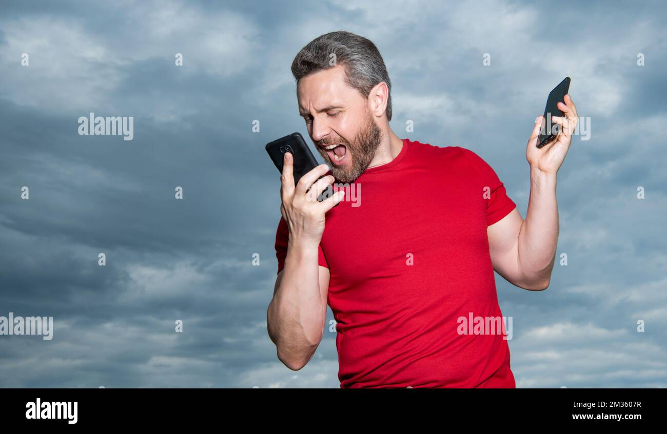 photo of angry man shouting has phone talk. man has phone talk on sky ...