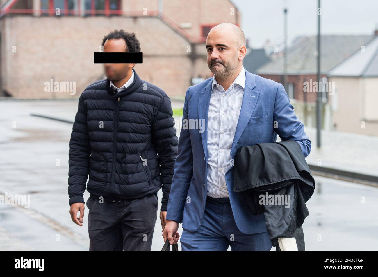 Lawyer Alex Buelens and one of the accused arrive for a session of the ...