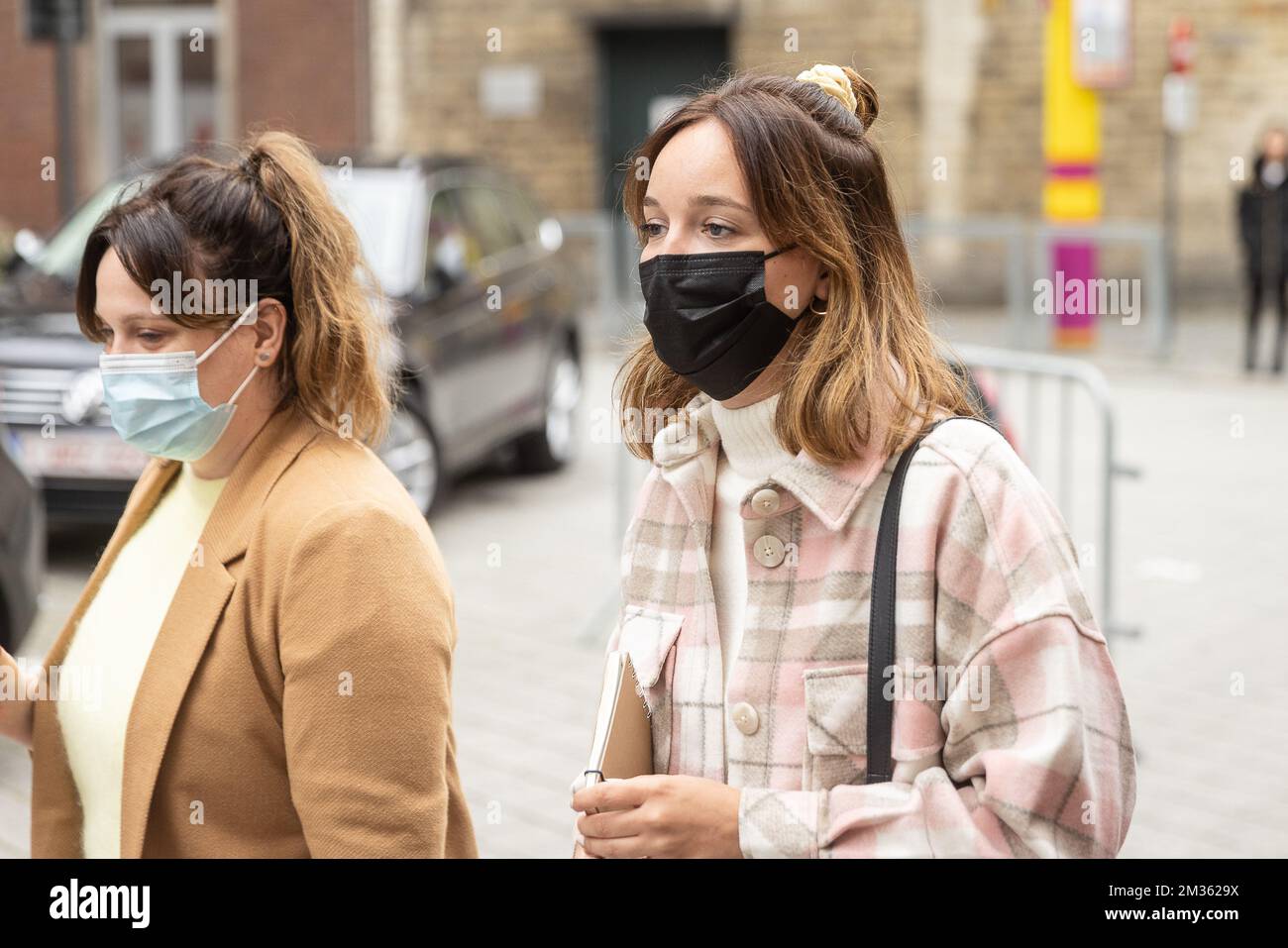 Unidentified women arrive for a session of the Criminal Court in ...