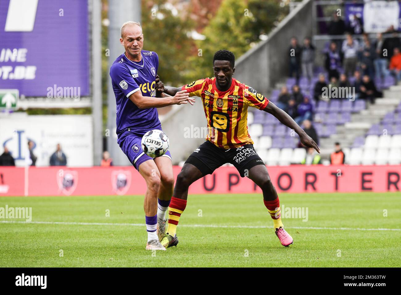 Beerschot's Raphael Rapha Holzhauser and Mechelen's Samuel Oum Gouet fight for the ball during a ...