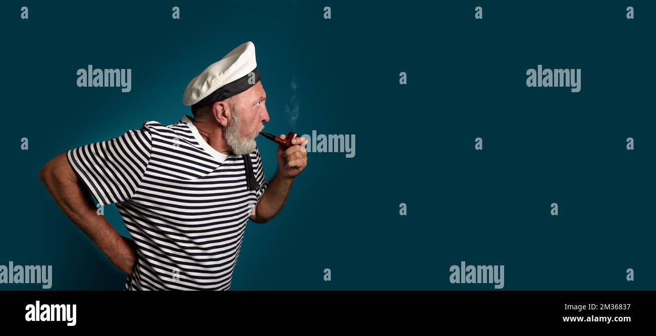 Banner with a cheerful sailor on a blue background. Copy space. Old ...