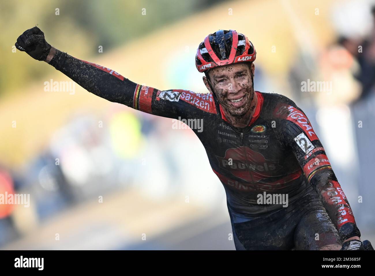Belgian Laurens Sweeck celebrates as he crosses the finish line to win ...