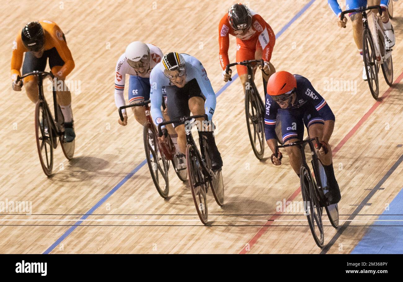 France's Donovan Grondin (R) crosses the finish line to win followed by ...