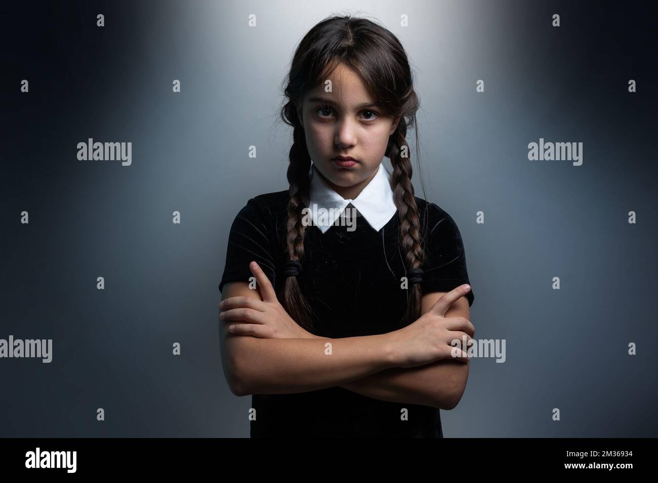 a girl in a Wednesday Addams costume style Stock Photo - Alamy