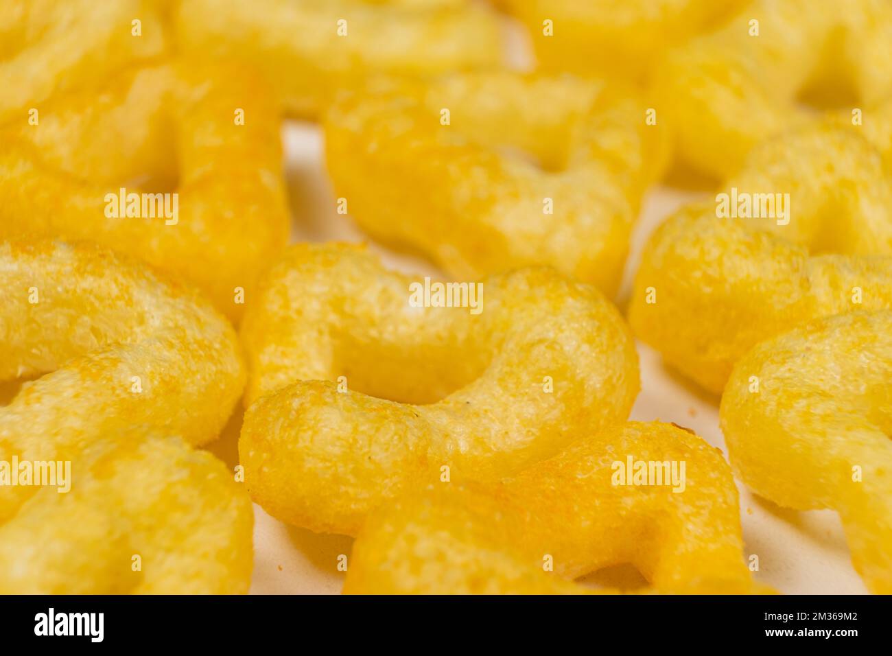 Delicious crispy corn chips triangular shape with spices, macro Stock ...