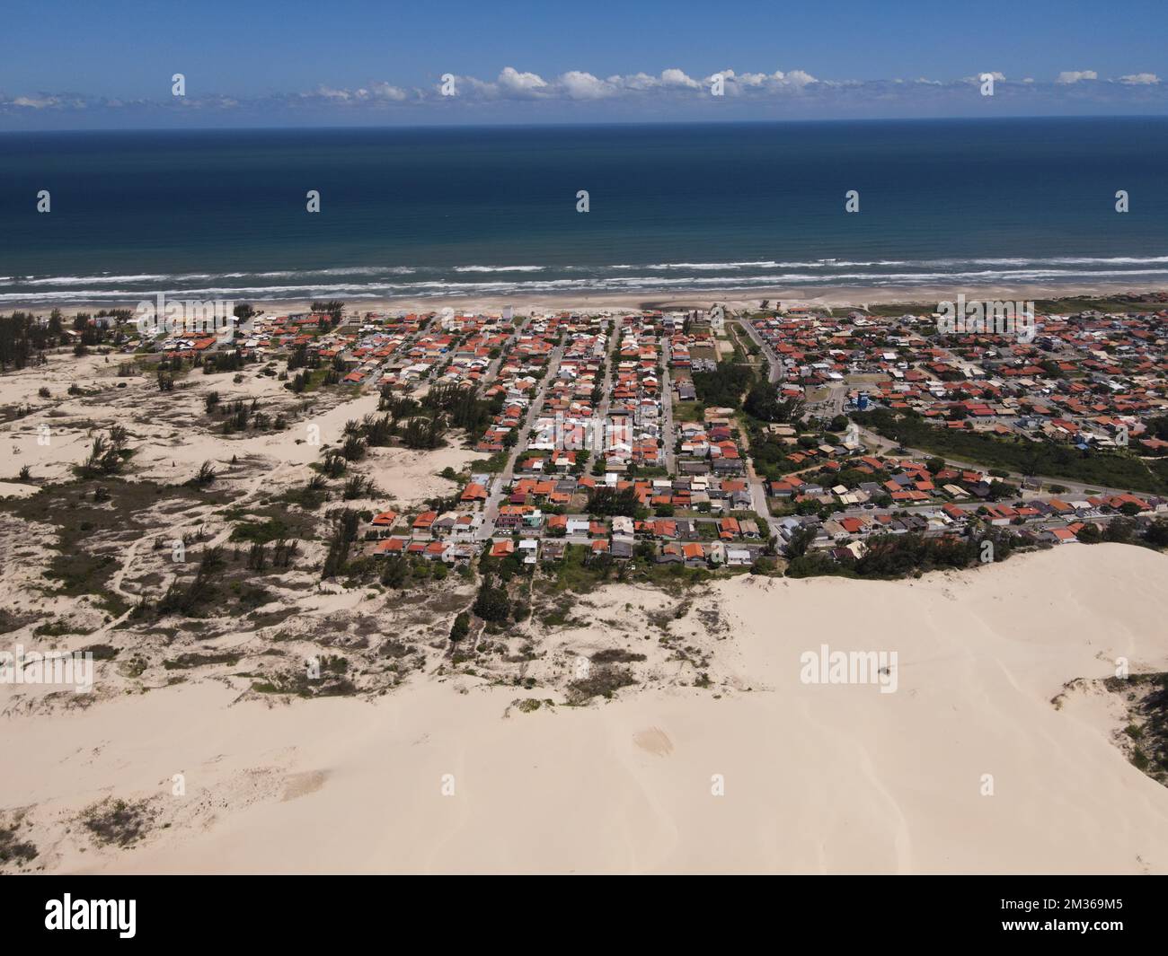 An aerial shot of a sandy beach arena in Jaguaruna, Santa Catarina ...