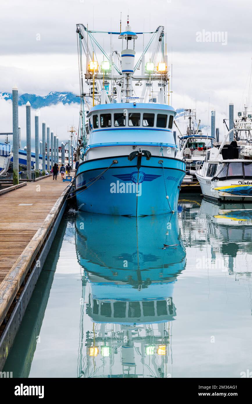 Commercial and charter fishing boats in foggy harbor; Valdez; Alaska ...