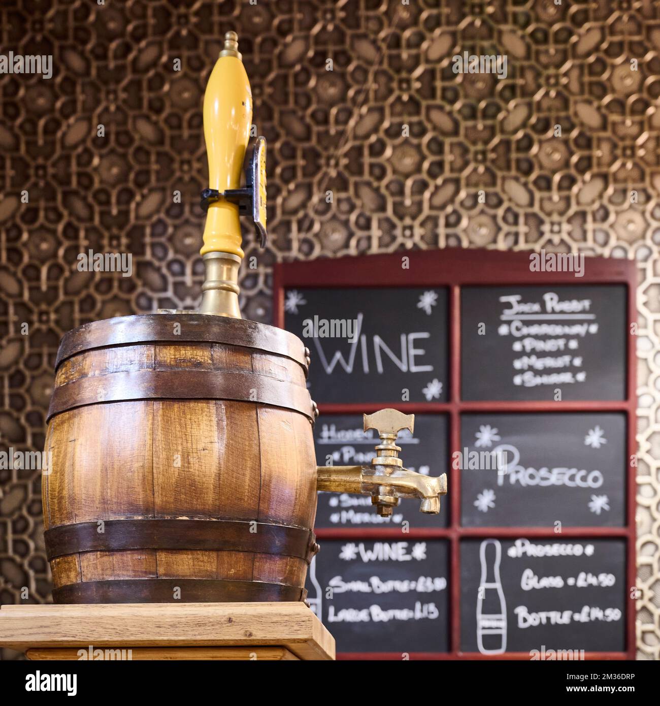 Wood cask and drinks menu board in pub interior Stock Photo - Alamy