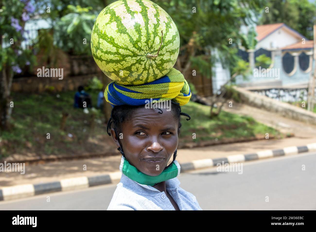 Illustration picture shows a woman carrying a watermelon in Kigali ...