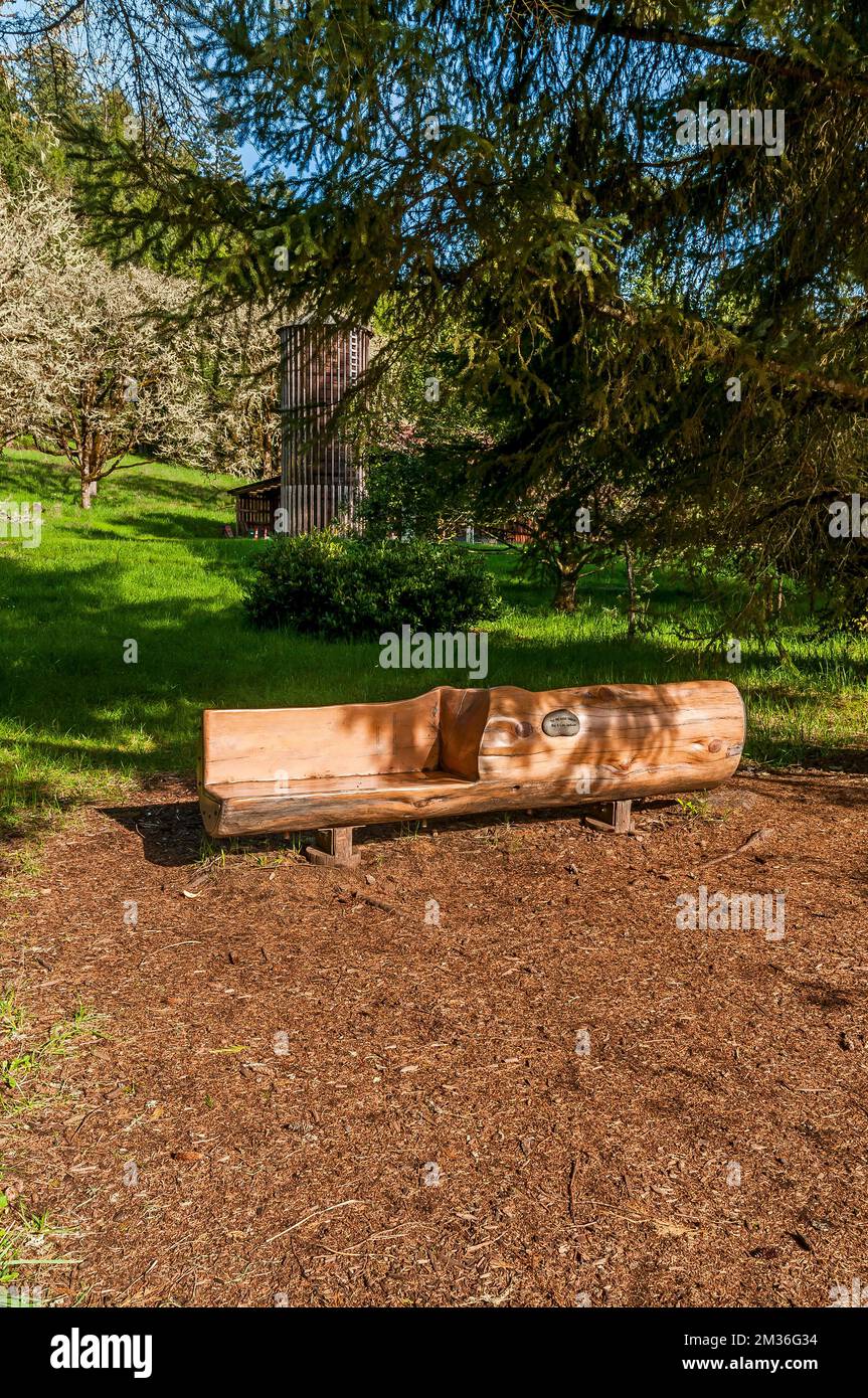 Log bench near the old barn with a silo near Mt Pisgah Arboretum, Coast ...