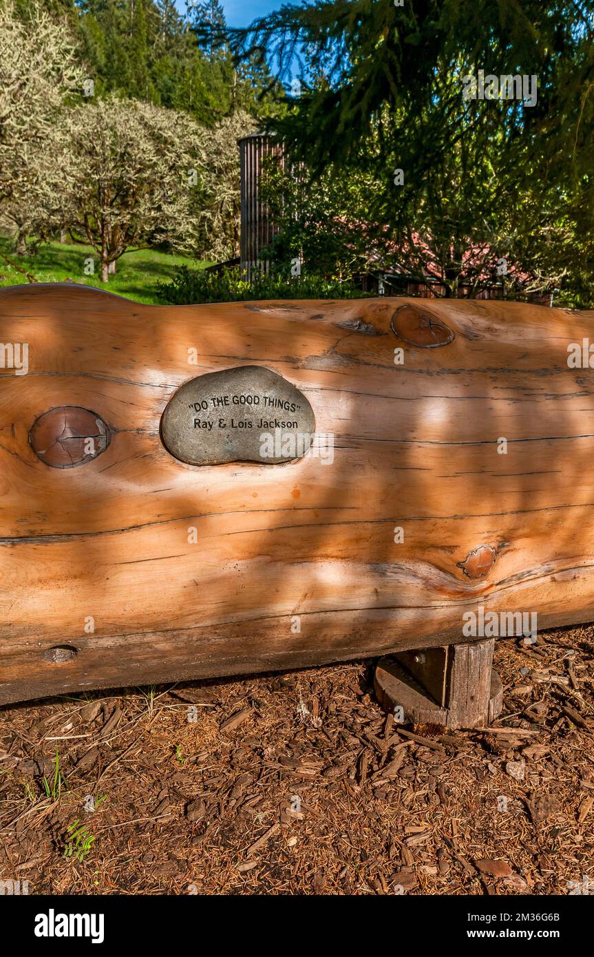 Log bench near the old barn with a silo near Mt Pisgah Arboretum, Coast ...
