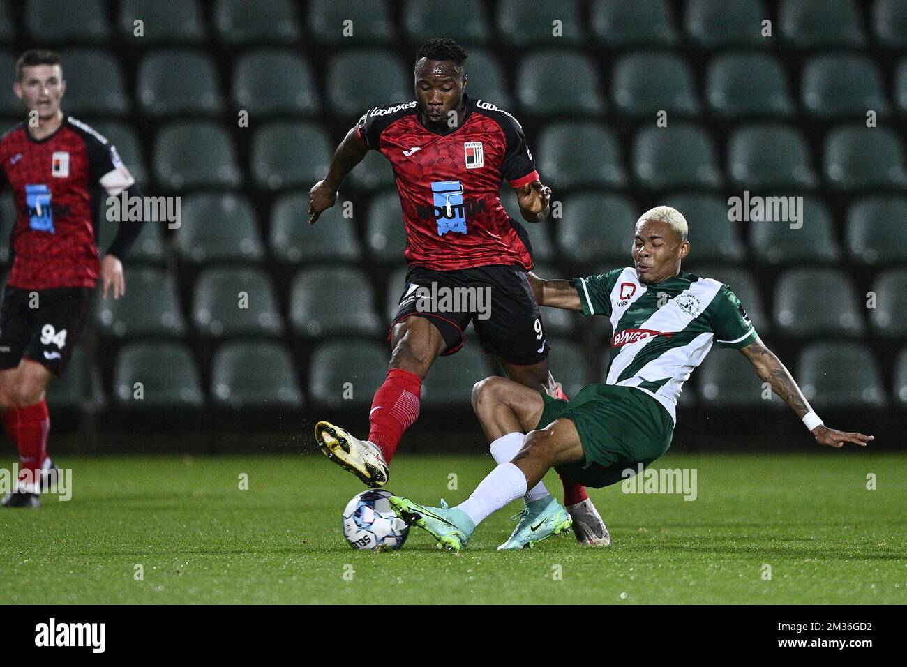 Rwdm's William Togui and Lommel's Caio Roque fight for the ball during ...