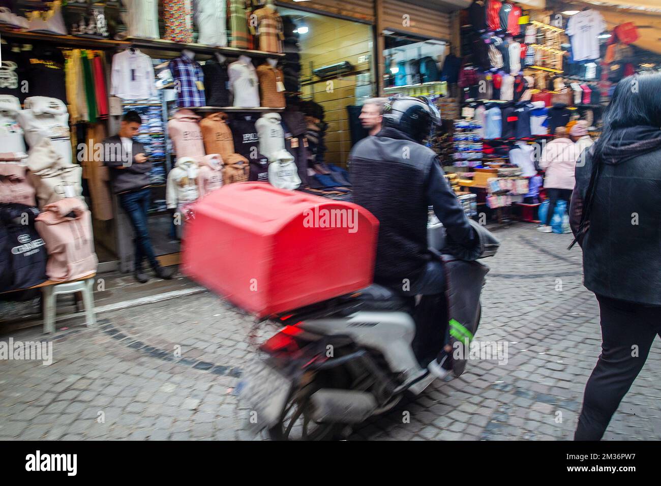 12-07-2022 courier riding a scooter in famous Istanbul Grand Bazaar ...