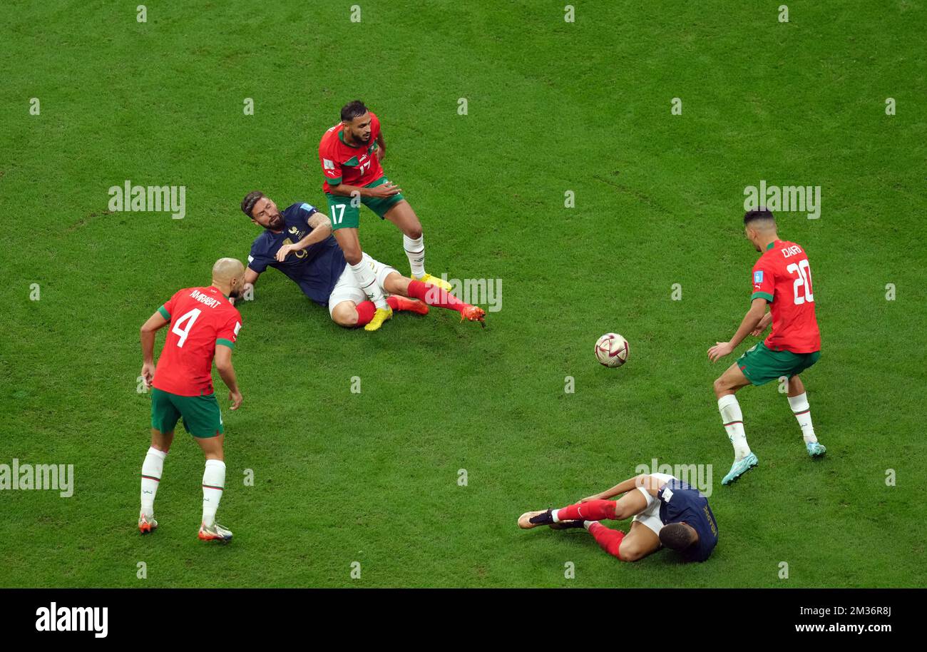 France's Olivier Giroud challenges Morocco's Sofiane Boufal (right) as ...