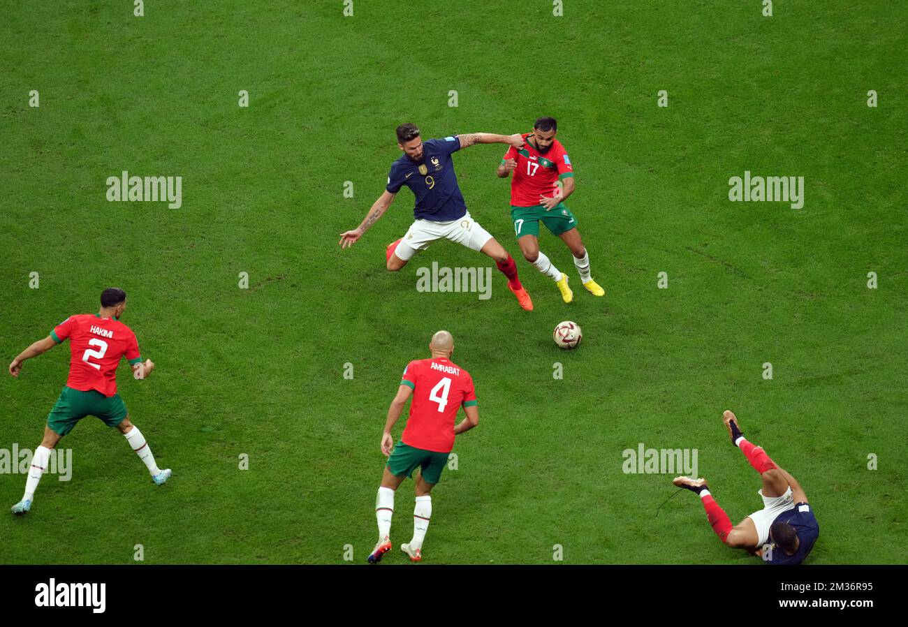 France's Olivier Giroud challenges Morocco's Sofiane Boufal (right) as ...